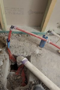 Moving PEX piping coming from slab into wall to cap off | Terry Love ...